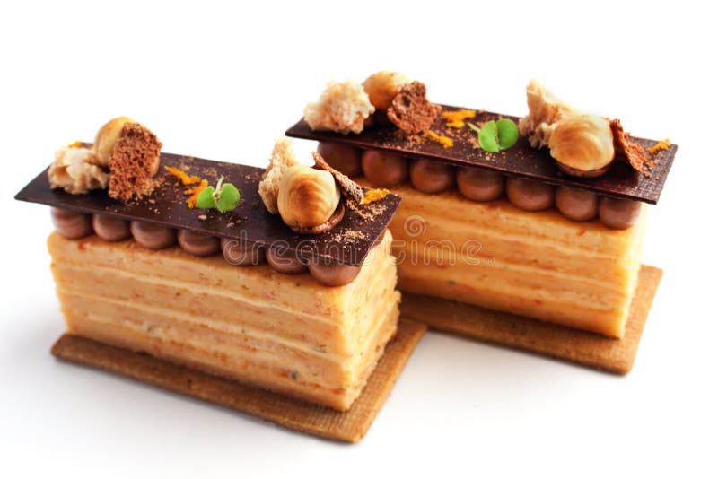 Orange Opera Cake Slices with Hazelnuts and Ganache Isolated on White ...