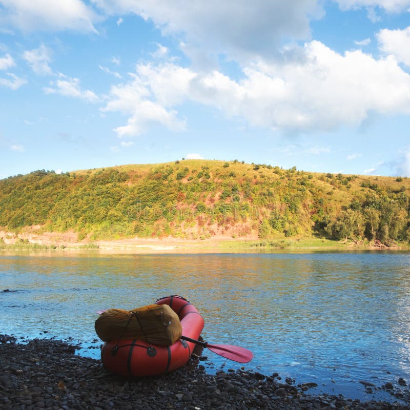 Orange Packraft Rubber Boat with Backpack on a River Stock Photo ...