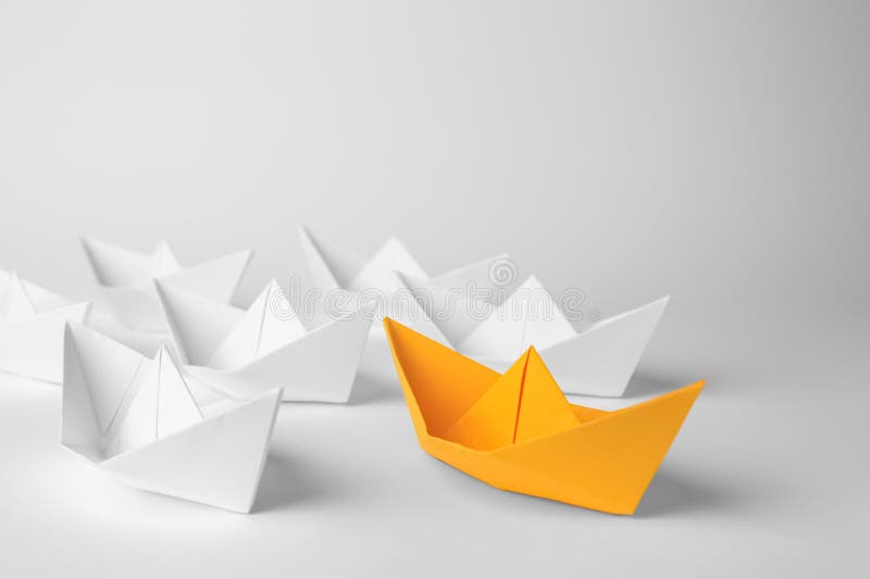 Orange Paper Boat among Others on White Background. Leadership Concept ...