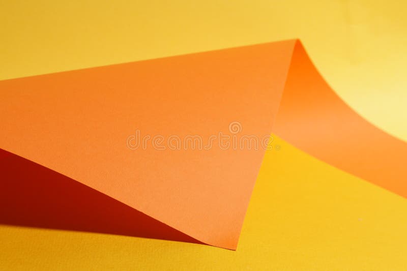 Orange Paper Sheet on Yellow Background, Closeup Stock Photo - Image of ...