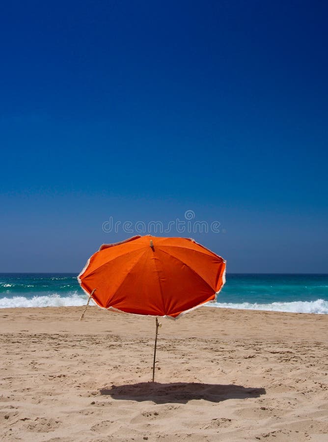 Orange Parasol on the Beach Stock Image - Image of idyllic, loneliness ...