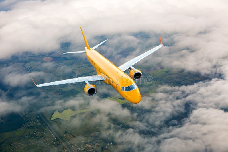 Orange Passenger Aircraft Flies High Above the Clouds Stock Photo ...