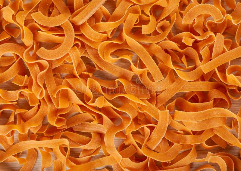 Orange Pasta, Dry Pasta with Tomatoes Background Stock Photo - Image of ...