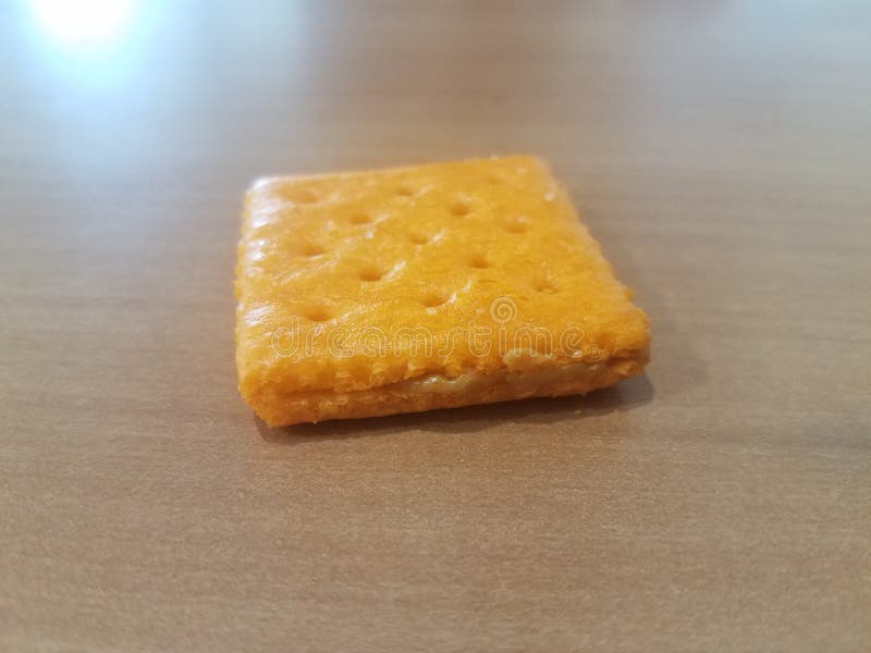 Orange Peanut Butter Cracker on Brown Wood Table Stock Image - Image of ...