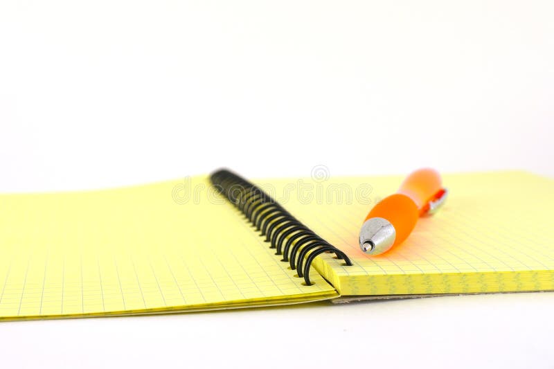 Orange Pen on the Yellow Writing-book Stock Photo - Image of notepaper ...