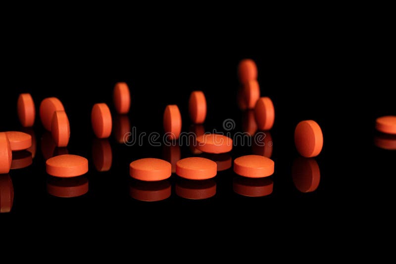 Orange Pharmacy Tablet Isolated on Black Glass Stock Image - Image of ...