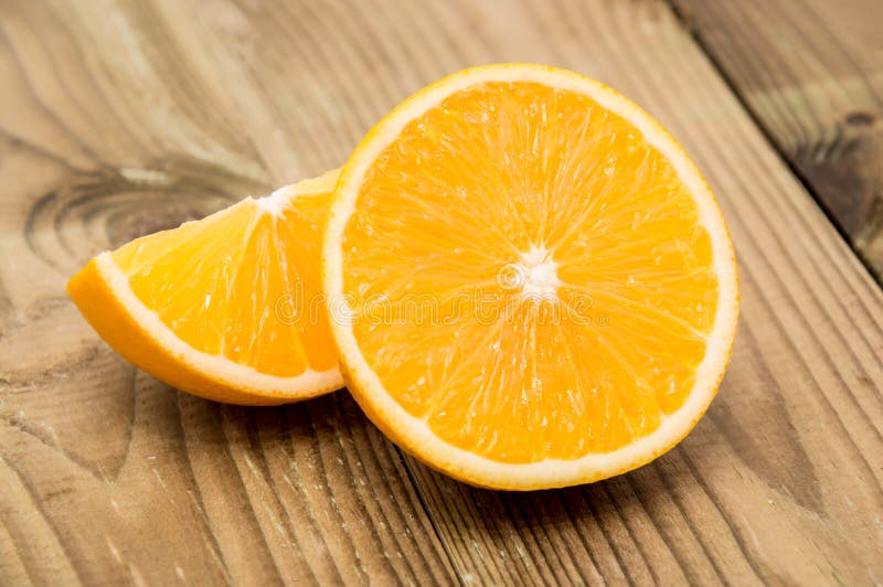 Orange pieces on wood stock photo. Image of citrus, studio - 26874870
