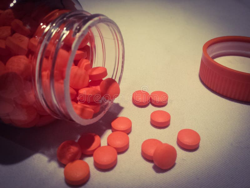 Orange pills stock photo. Image of medicine, medication - 48689424