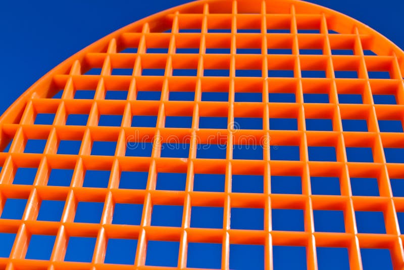 Orange plastic racket stock image. Image of racquet - 123352909