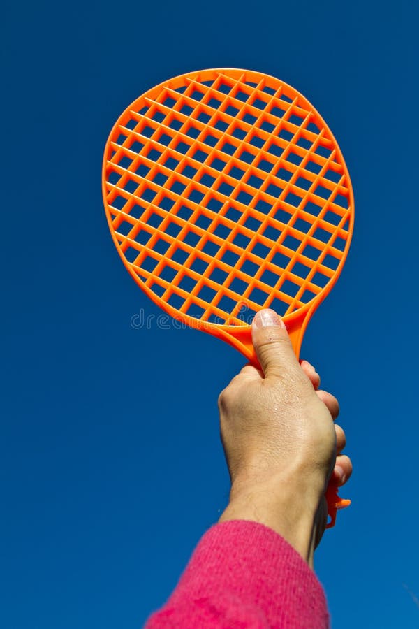Orange plastic racket stock photo. Image of plastic - 123352864