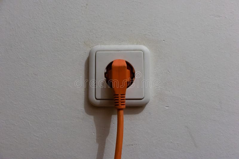 Orange Plug Connected To a White Socket Stock Image - Image of home ...