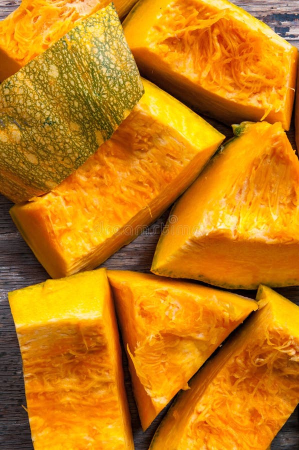 Raw Sliced Pumpkin Chunks with Seeds on White Background Stock Photo ...