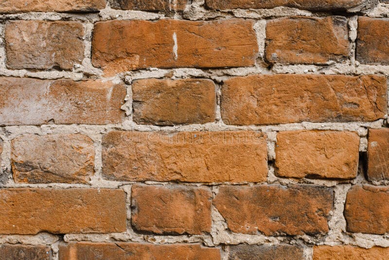 Old Red Ragged Brick Wall with Gray Cement, Stains of White Paint ...