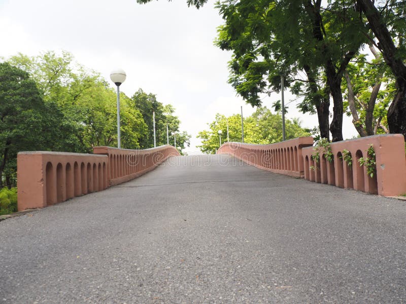 Orange Railing Bridge, Green Leaves and White Cloud Sky. Stock Image ...