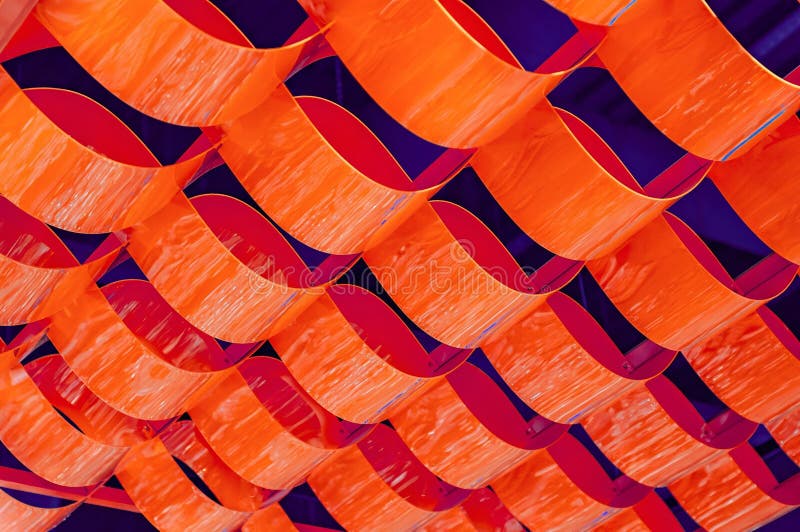An Orange and Red Ribbon-like Design Interlocks To Form an Abstract ...