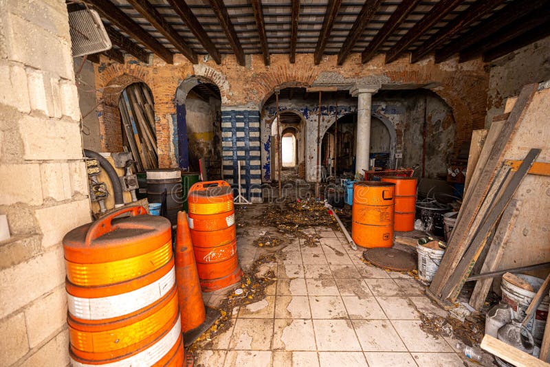 Orange Road Construction Barrels Inside Dirty Damaged Building Stock ...