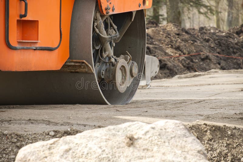 Orange Road Roller Engaged in Construction Work Stock Photo - Image of ...