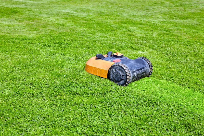 Orange Robot Lawn Mower on Lawn with Mowed Path Stock Image - Image of ...