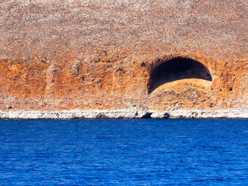 Orange Rock Cliffs and Deep Blue Waters Stock Image - Image of stone ...