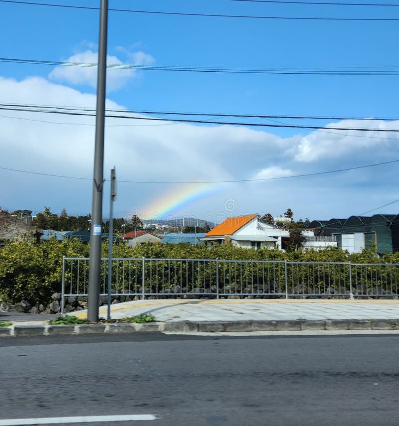 An Orange Roof and a Clear Rainbow Stock Photo - Image of roof, clear ...
