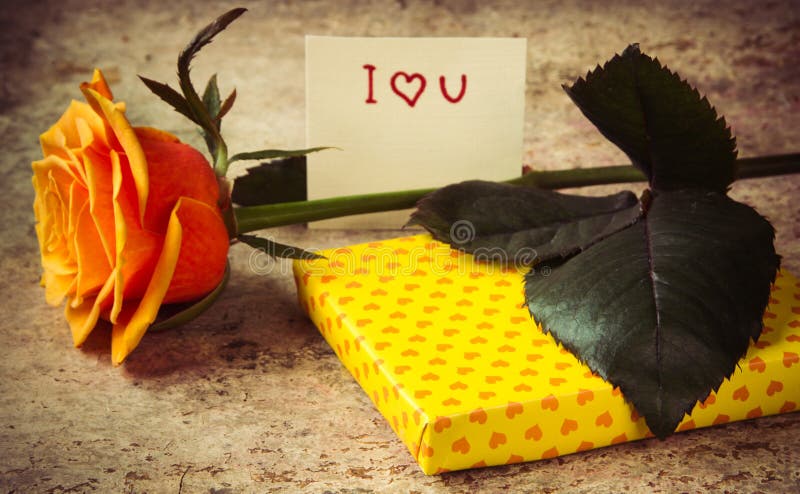 Orange Rose, Gift Covered in Hearted Paper and Note I Love You Stock ...