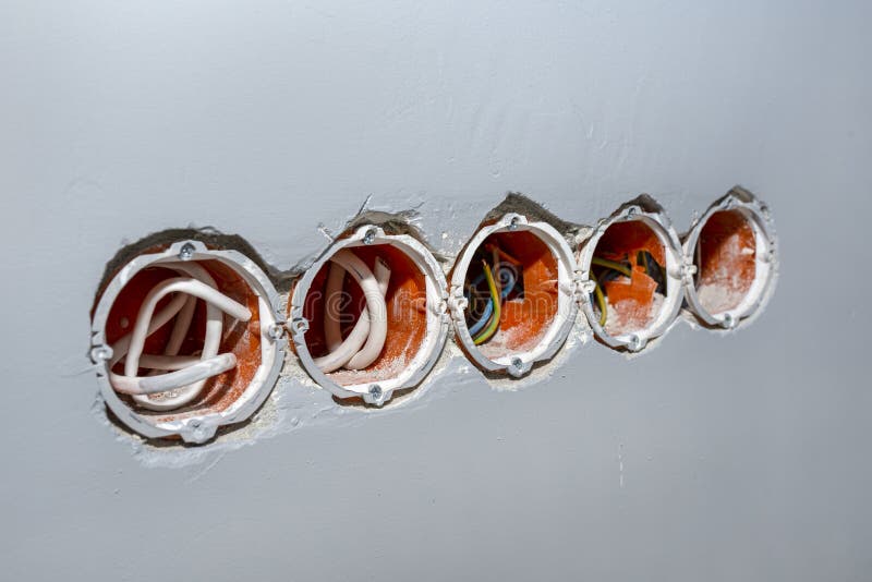 Orange, Round Junction Box Mounted in the White Wall with Protruding ...