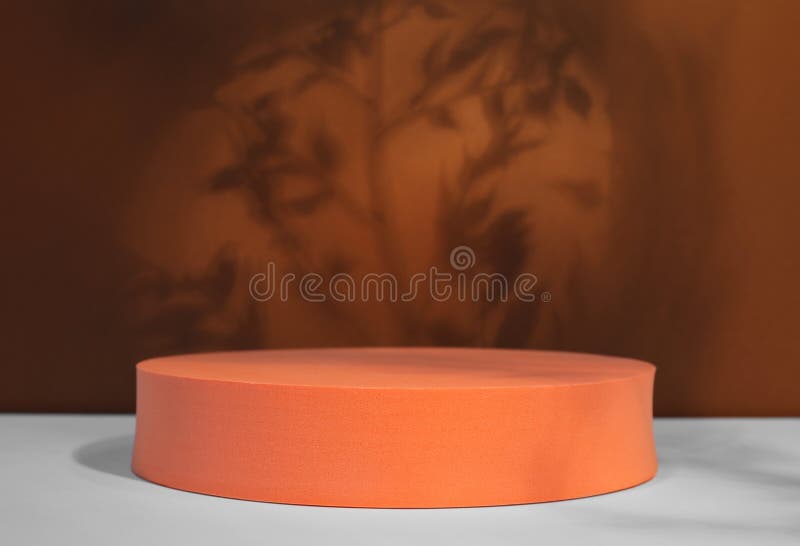 Orange Round Stand on White Table. Stylish Presentation for Product ...
