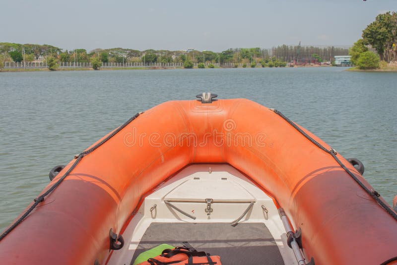 Orange Rubber Boat on Lake. Stock Photo - Image of blue, freshwater ...
