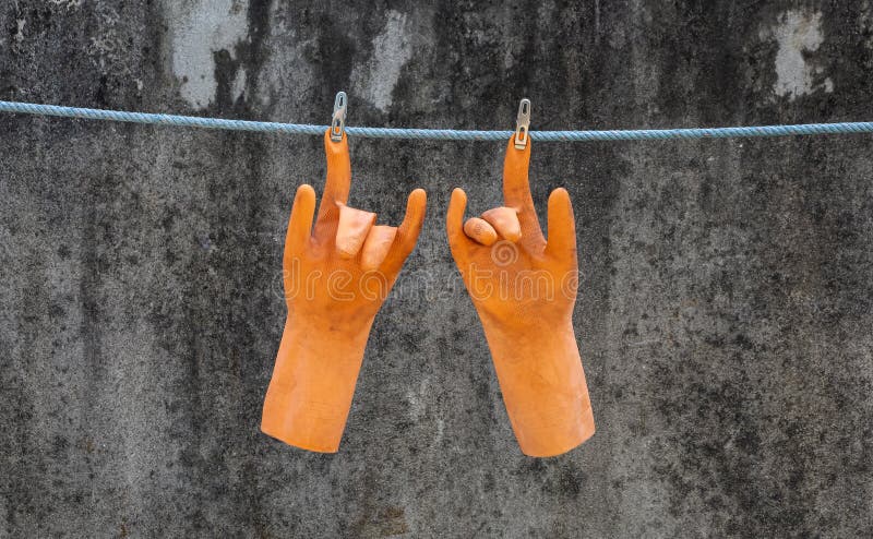 The Orange Rubber Gloves are Hanging on the Plastic String Stock Photo ...