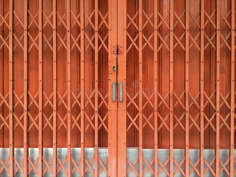 Orange Rusty Sliding Metal Door Stock Photo - Image of rivets, iron ...