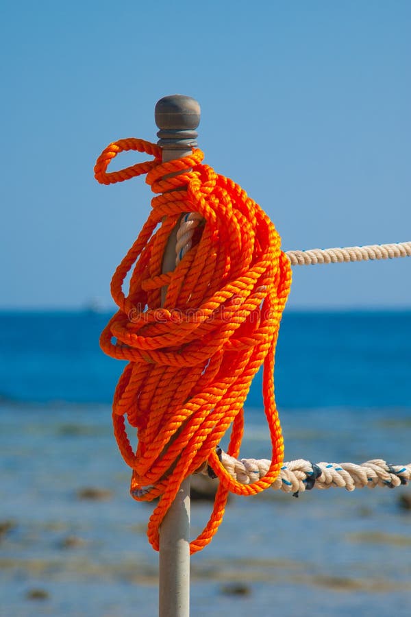 Orange safety rope on pier stock photo. Image of idyllic - 112484154