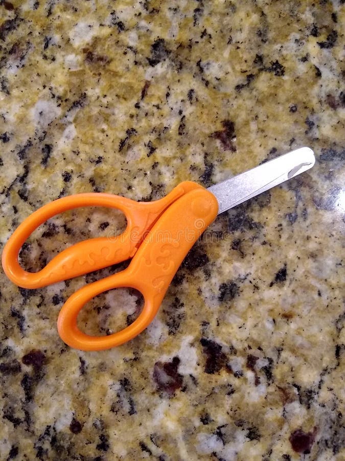 Orange Safety Scissors on a Marble Surface Stock Photo - Image of ...