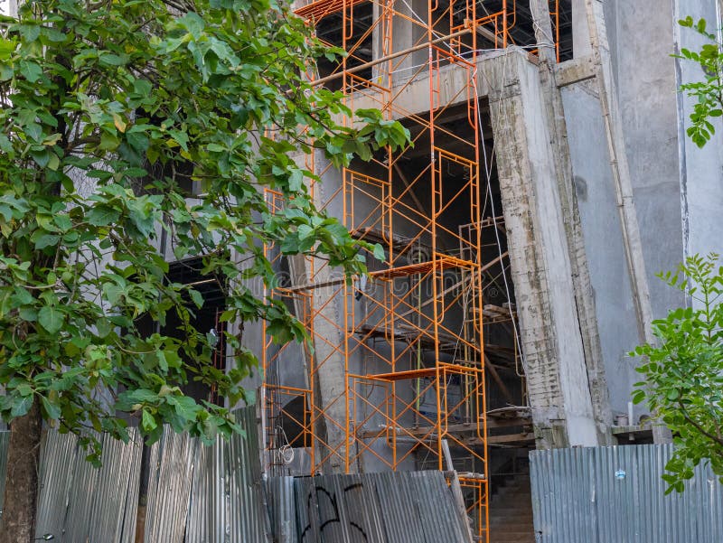 An Orange Scaffolding Structure Built To Form Proper Footing Support ...