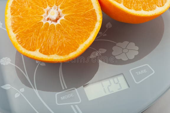Orange on the scale. stock image. Image of freshness - 28224359
