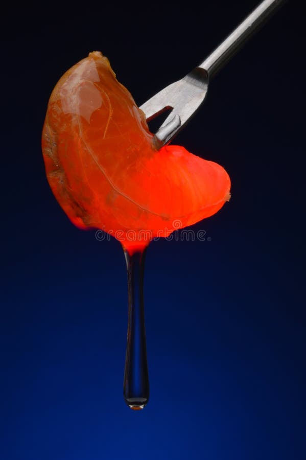 Orange Section Dripping with Syrupy Glaze Stock Photo - Image of ...