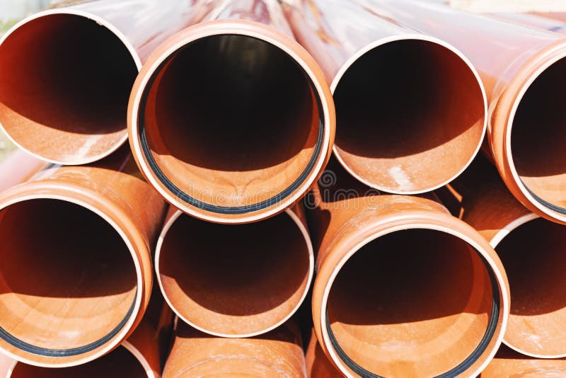 Orange Sewer Pipes at the Construction Site. Preparation for the ...
