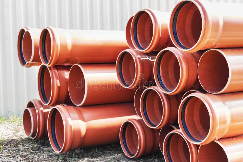 Orange Sewer Pipes at the Construction Site. Preparation for the ...