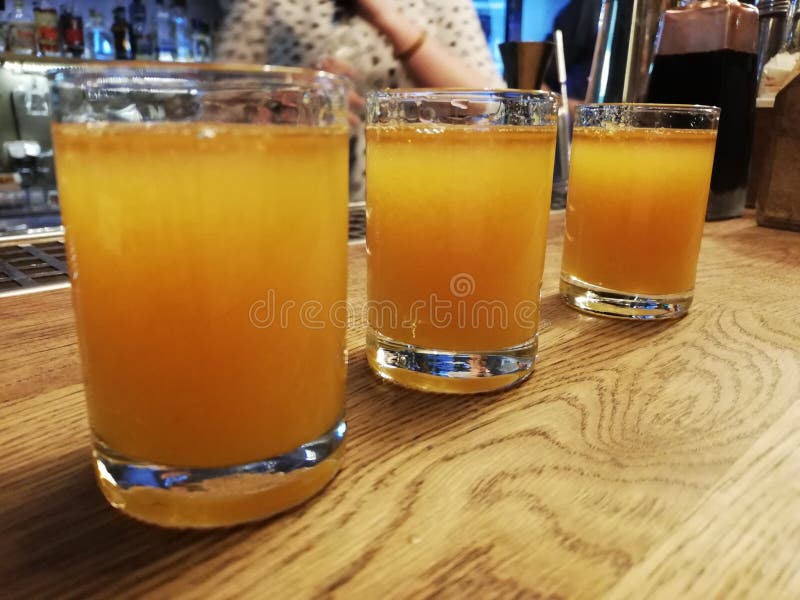 Orange shots line stock image. Image of alcohol, orange - 154349303