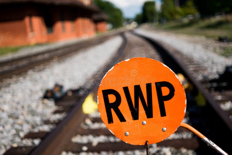 Train Rails and Orange Sign Showing the Path Stock Image - Image of ...
