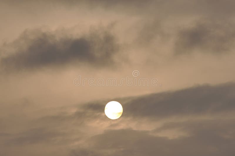 Orange Sky with Sun Peeking through Clouds Stock Image - Image of glow ...