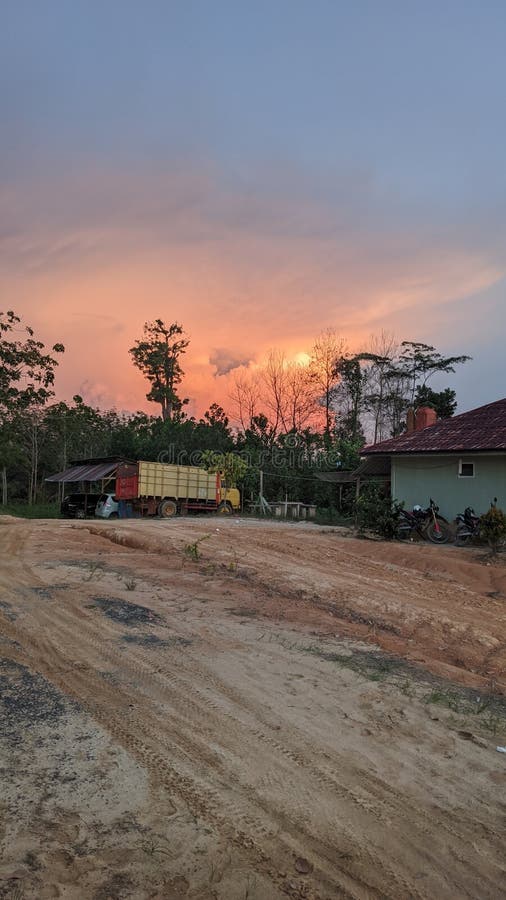The Orange Sky Sunset Over the Village Stock Image - Image of jungle ...