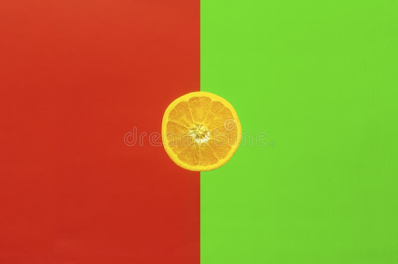 Orange Slice, Half Sliced Orange Against a Colored Background, Half in ...