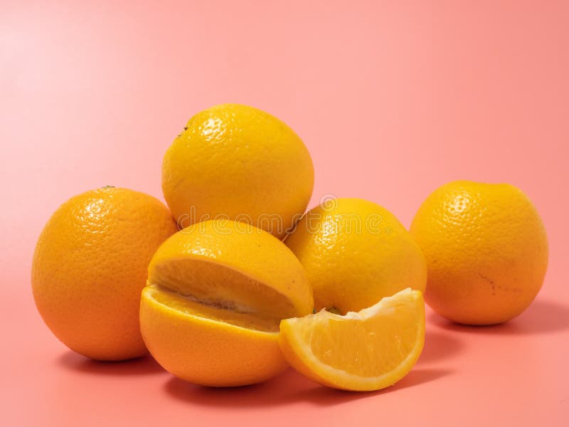 Orange and Orange Slice. Orange on a Pink Background Stock Image ...