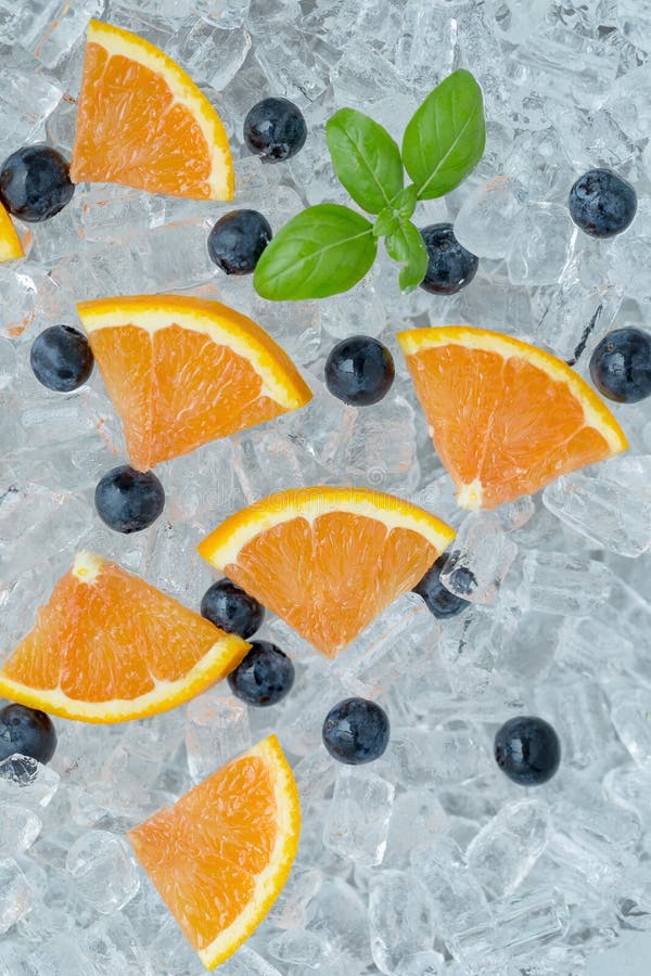 Orange Sliced and Blueberries on Ice Tube Background Stock Photo ...