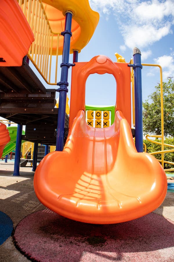 Orange Slide for Children in a Park Stock Photo - Image of happy ...