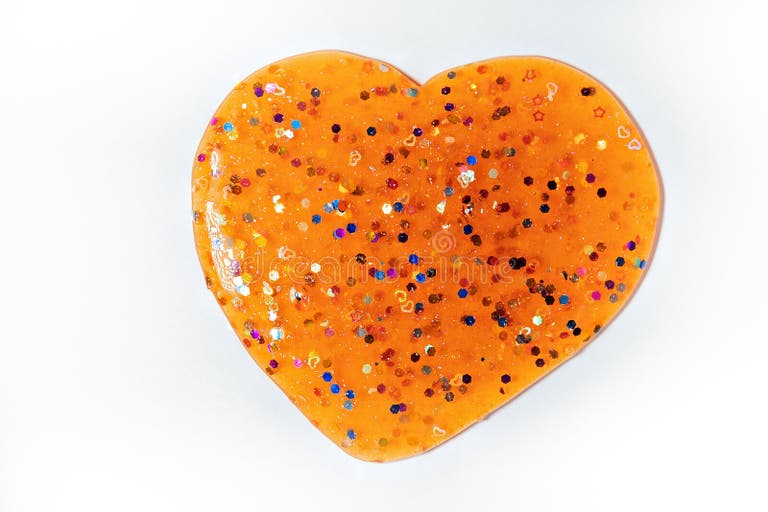 Orange Slime with Sequins in Shape of Heart on White Background Stock ...