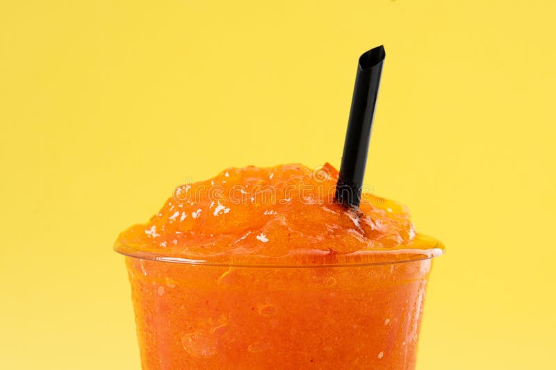 Orange Slushie on Yellow Background Stock Photo - Image of summer ...