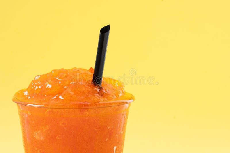 Orange Slushie on Yellow Background Stock Photo - Image of summer ...