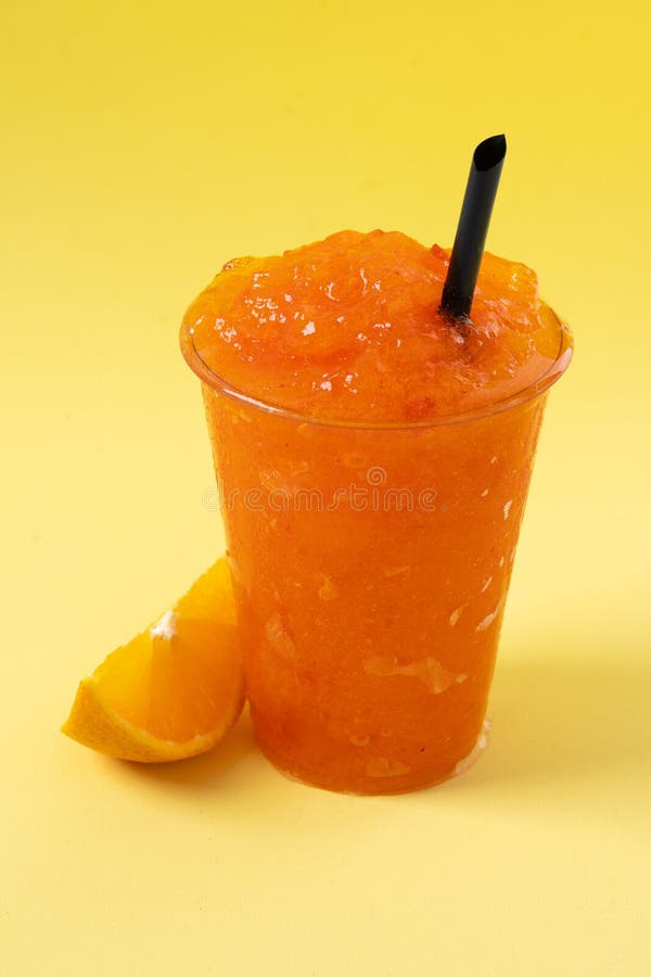 Orange Slushie on Yellow Background Stock Image - Image of fruit ...