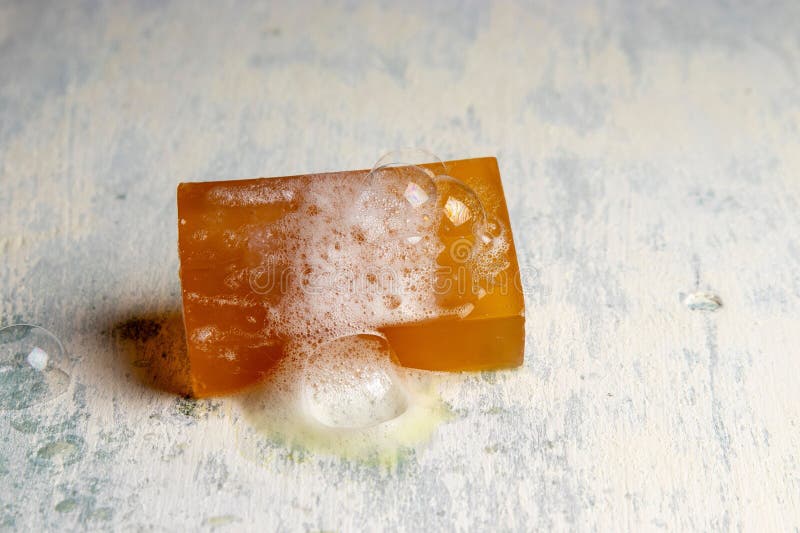 Orange Soap Bar with Bubbles on Textured Surface Stock Image - Image of ...